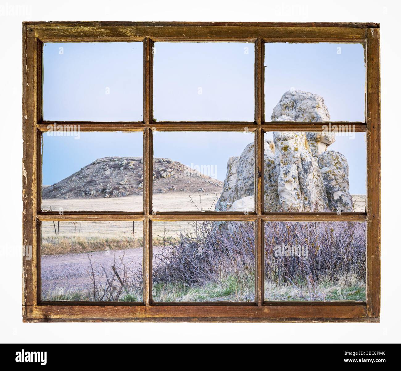 Dusk over prairie with rocks and a butte as seen through vintage ...