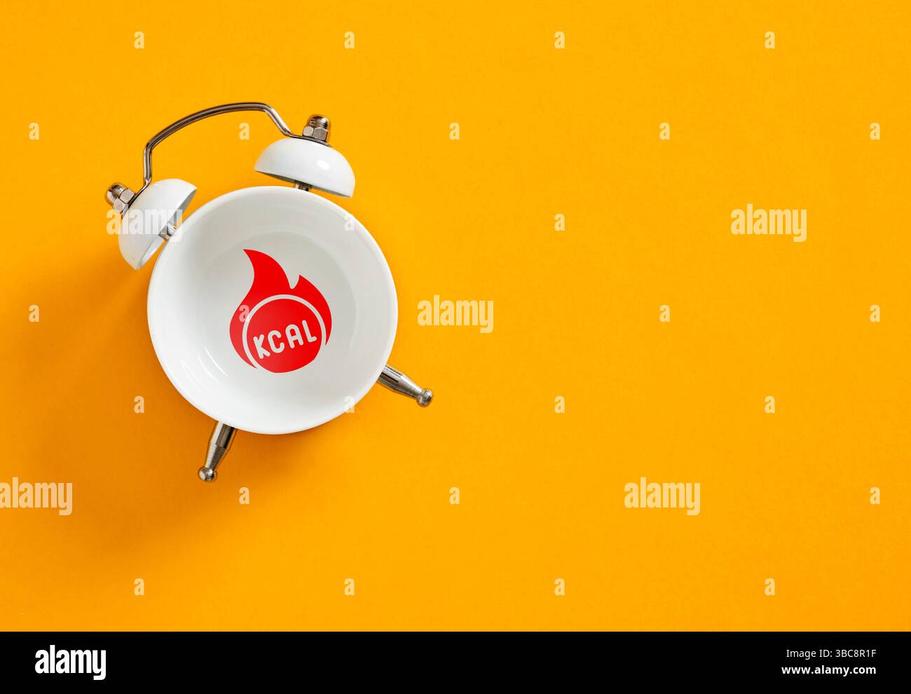 Intermittent fasting and calorie restriction concept with white alarm ...