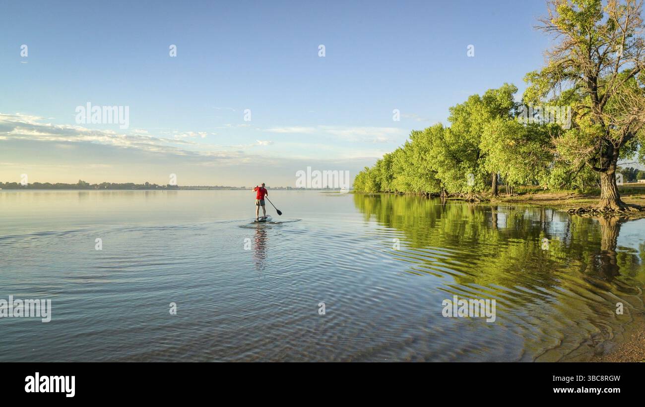 Paddling stand up paddleboard on a lake in summer - Boyd Lake State ...
