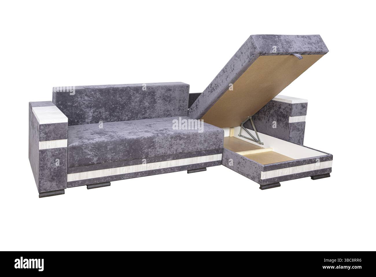 Grey unfolded sofa with velour fabric cushions against a white ...