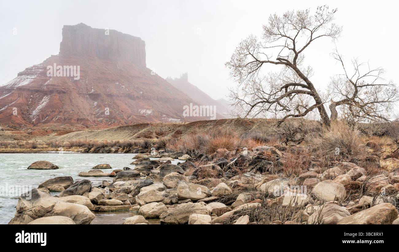 Colorado River at Rocky Rapid above Moab, Utah in a foggy winter ...
