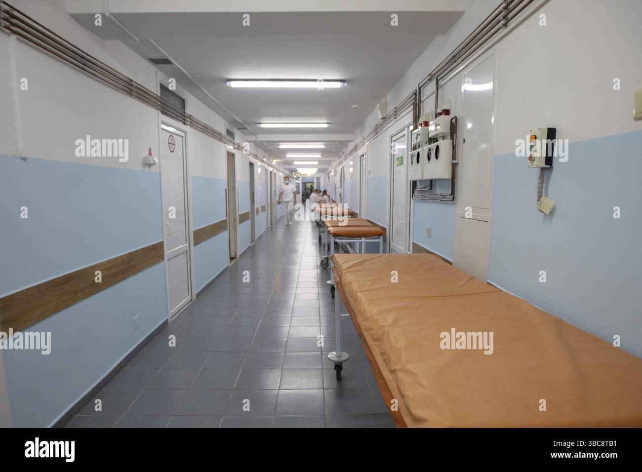 The hospital's long medical corridor with doctors and medical harnesses ...