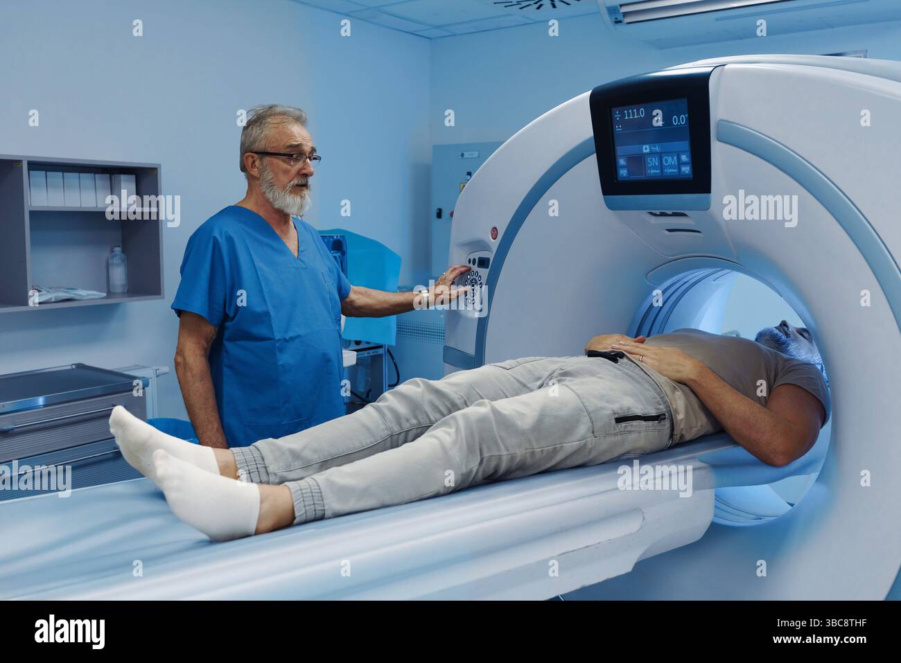 Male patient undergoing CT scan examination in hospital Stock Photo - Alamy