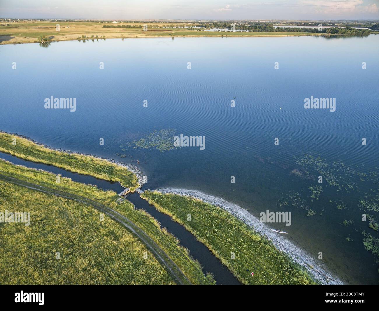 Lake (Lonetree Reservoir) and irrigation ditch in northern Colorado ...