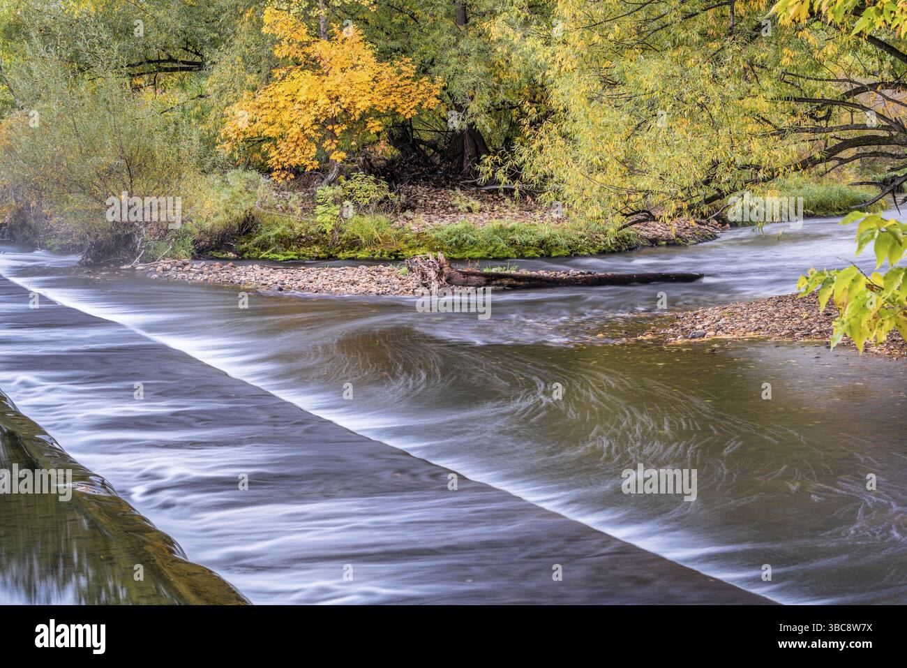 Water diversion dam on Poudre River in Fort Collins, Colorado - fall ...