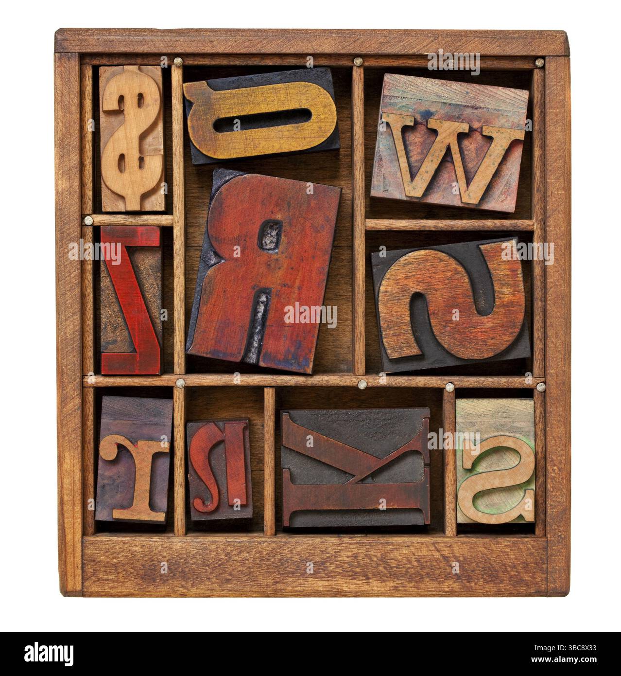 Vintage letterpress printing blocks in small wooden typesetter box with ...