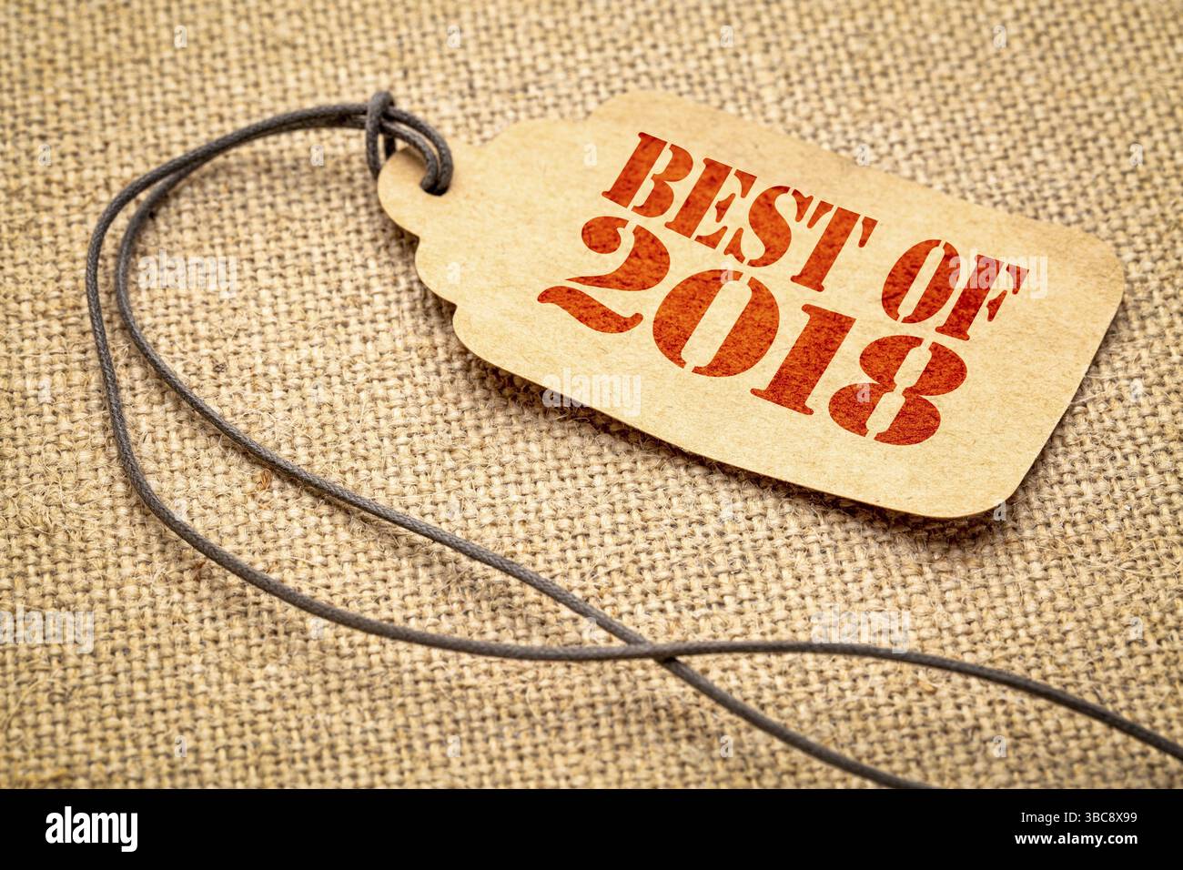 Best of 2018 sign - a paper price tag with a twine iagainst burlap ...