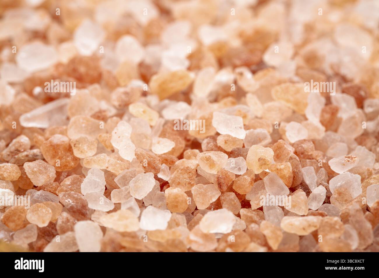 Background of Himalayan salt - pink and orange coarse crystals ...