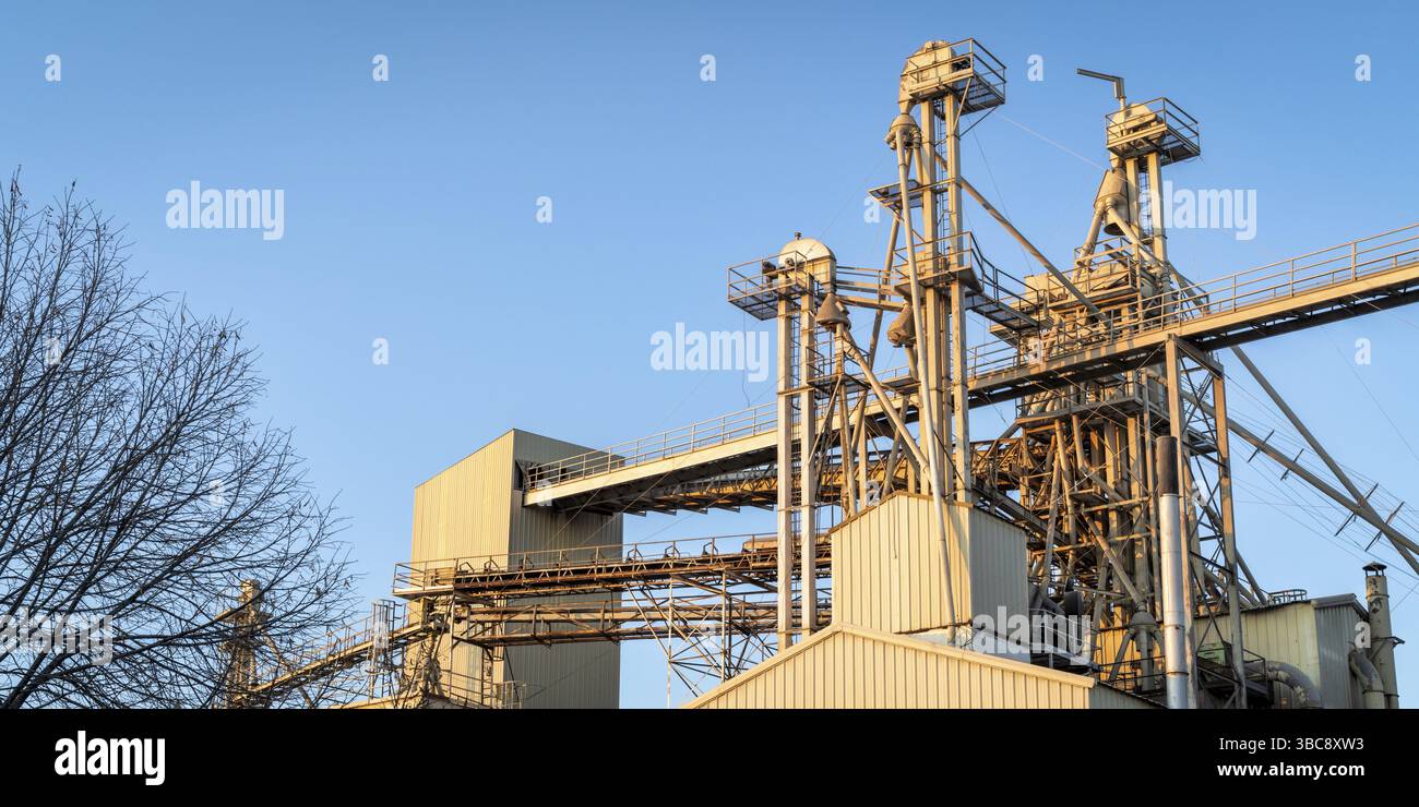 Industrial panorama abstract - top of a grain elevator with gravity ...