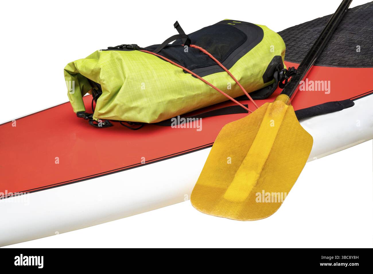 Isolated deck of an expedition stand up paddleboard with a paddle and ...