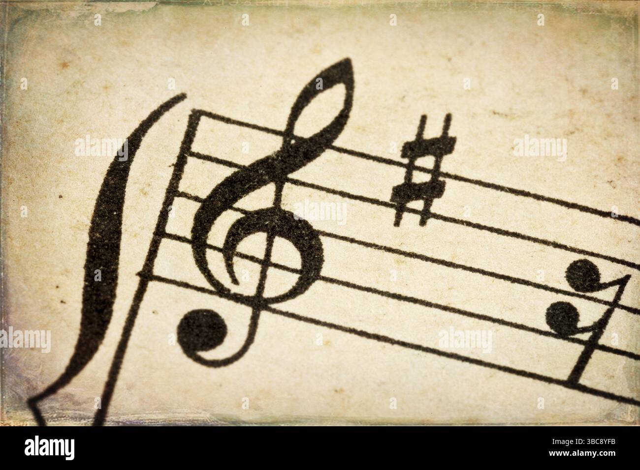 Treble clef - macro of sheet music on vintage paper with added grunge ...