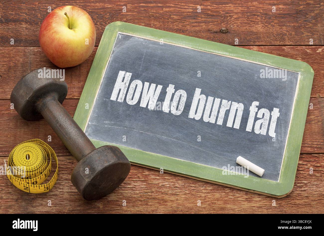 How to burn fat concept - slate blackboard sign against weathered red ...