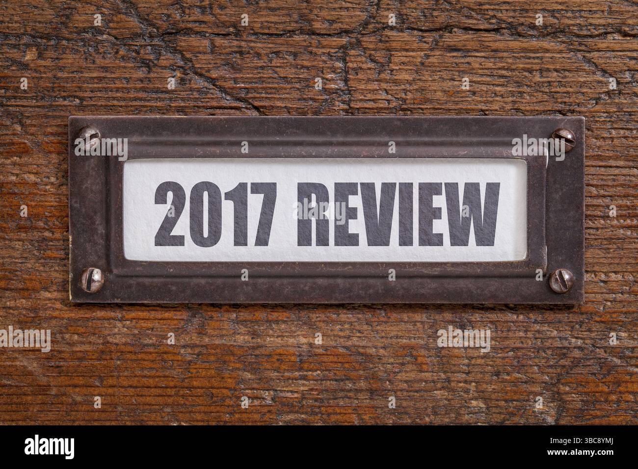 2017 review - a label on grunge wooden file cabinet. A passing year ...