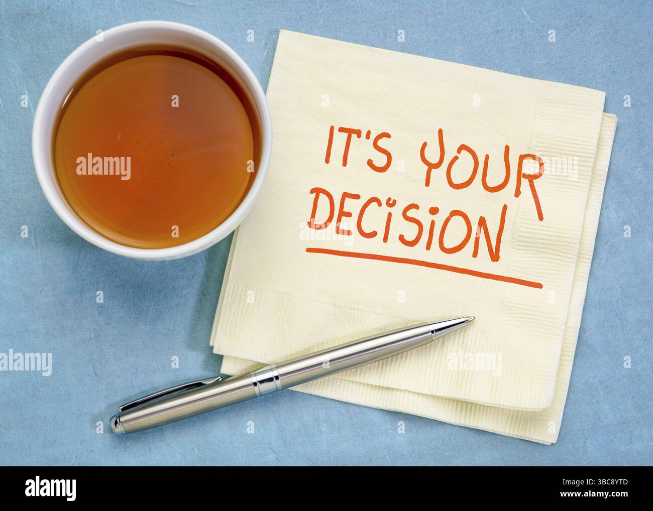 It is your decision note - handwriting on napkin with a cup of tea ...