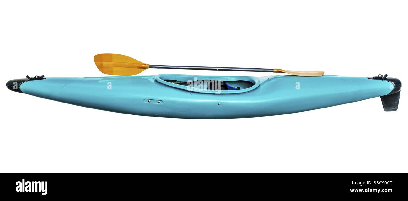 Used old style blue plastic whitewater kayak with a paddle, isolated on ...