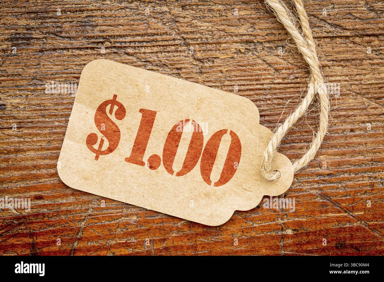 One dollar price tag price tag against a rustic barn wood - sale ...