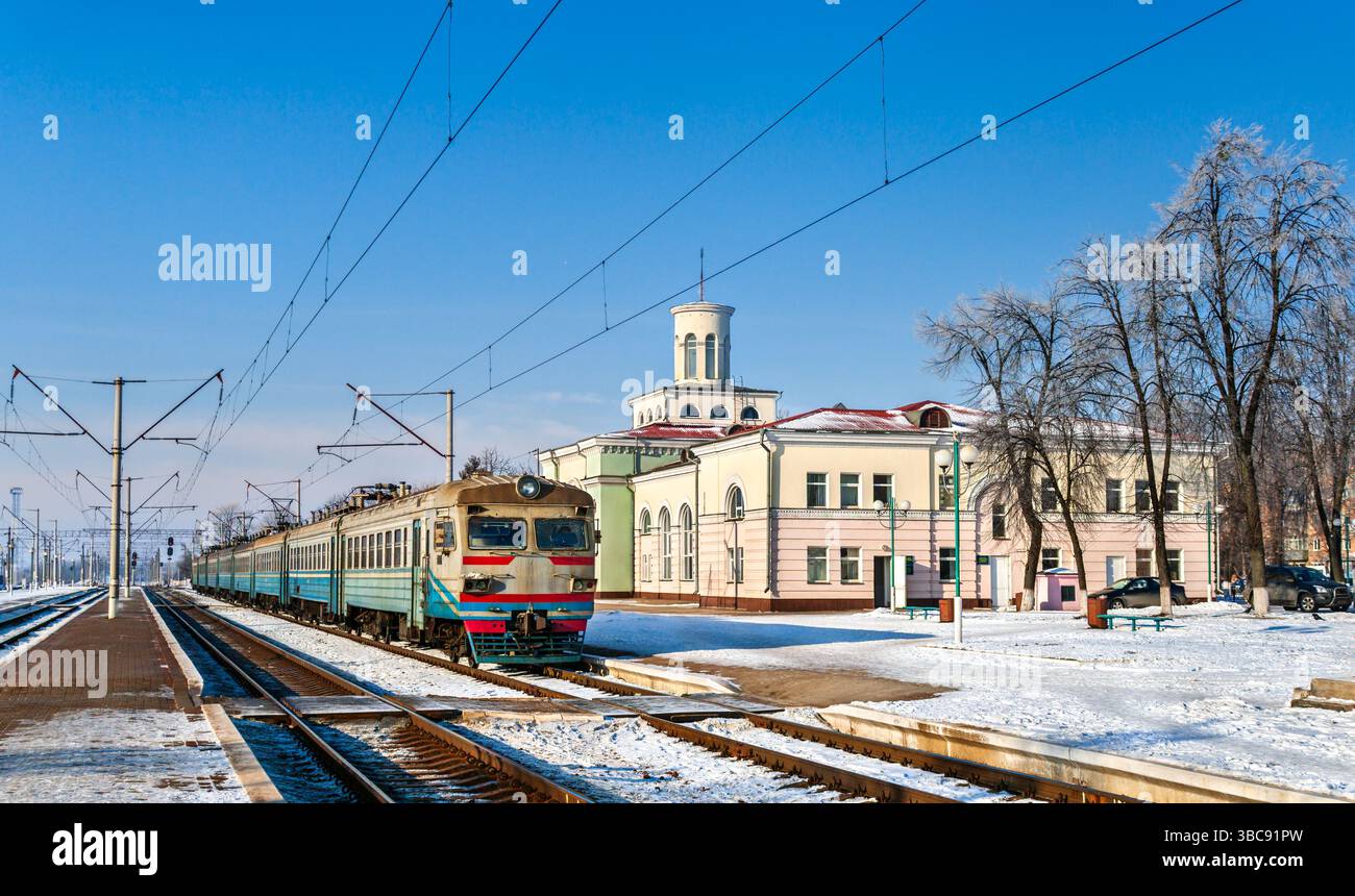 Old soviet electric commuter train in winter at Myronivka station in ...