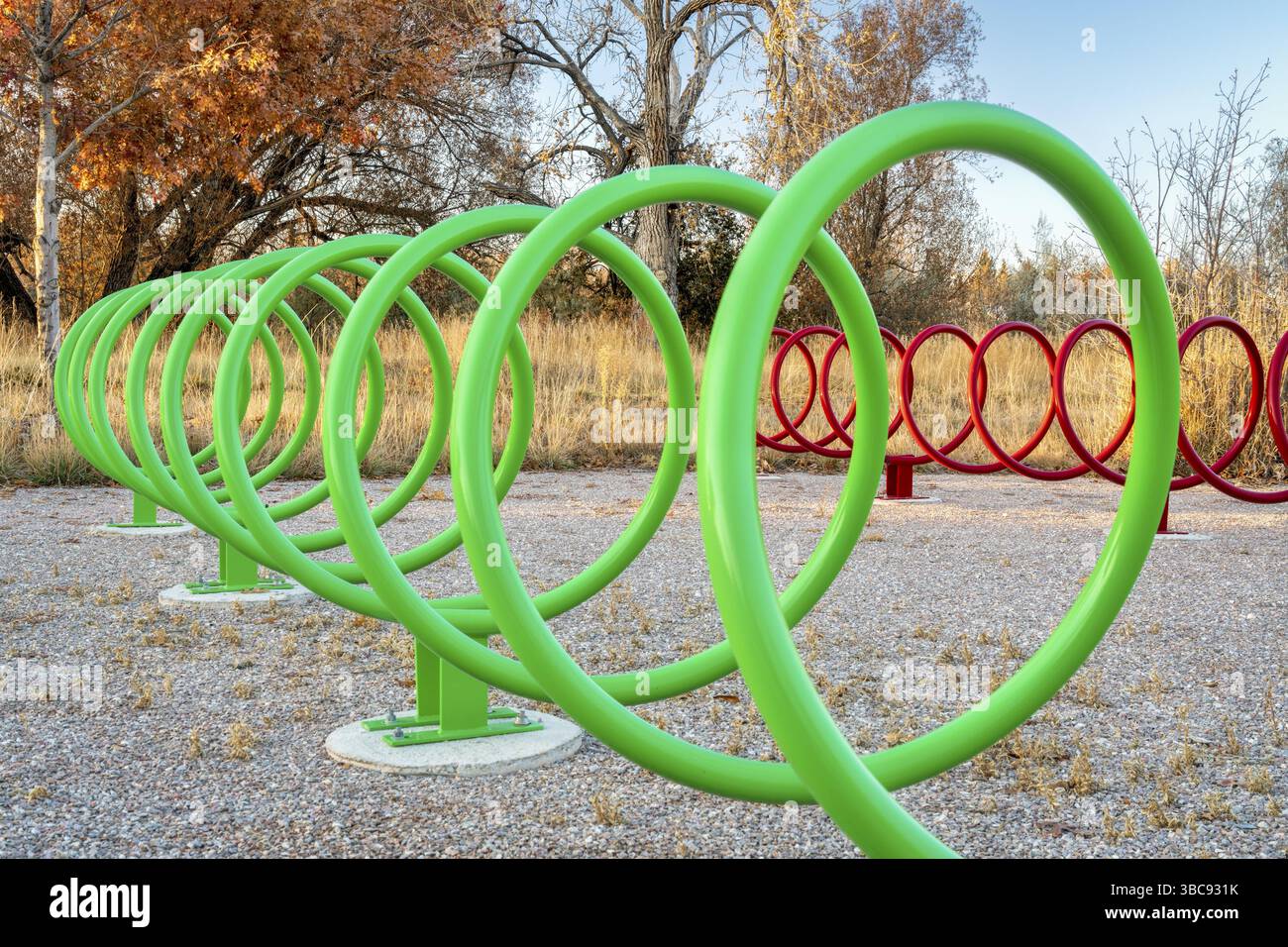 Colorful spiral shaped bike racks along a trail in Fort Collins ...