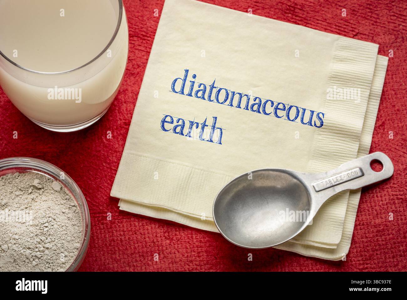 Food grade diatomaceous earth supplement - powder and in a glass of ...