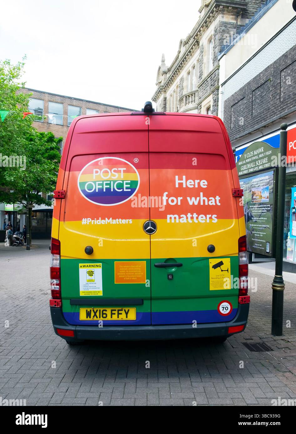 Post Office van rear back painted in support of LGBTQ+ Pride red orange ...