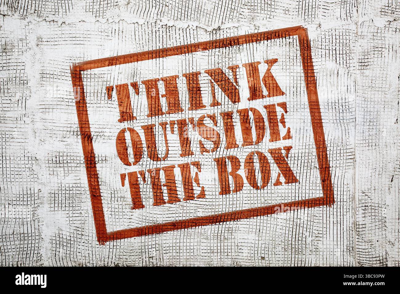 Think outside the box - graffiti sign with arrow on stucco wall Stock ...