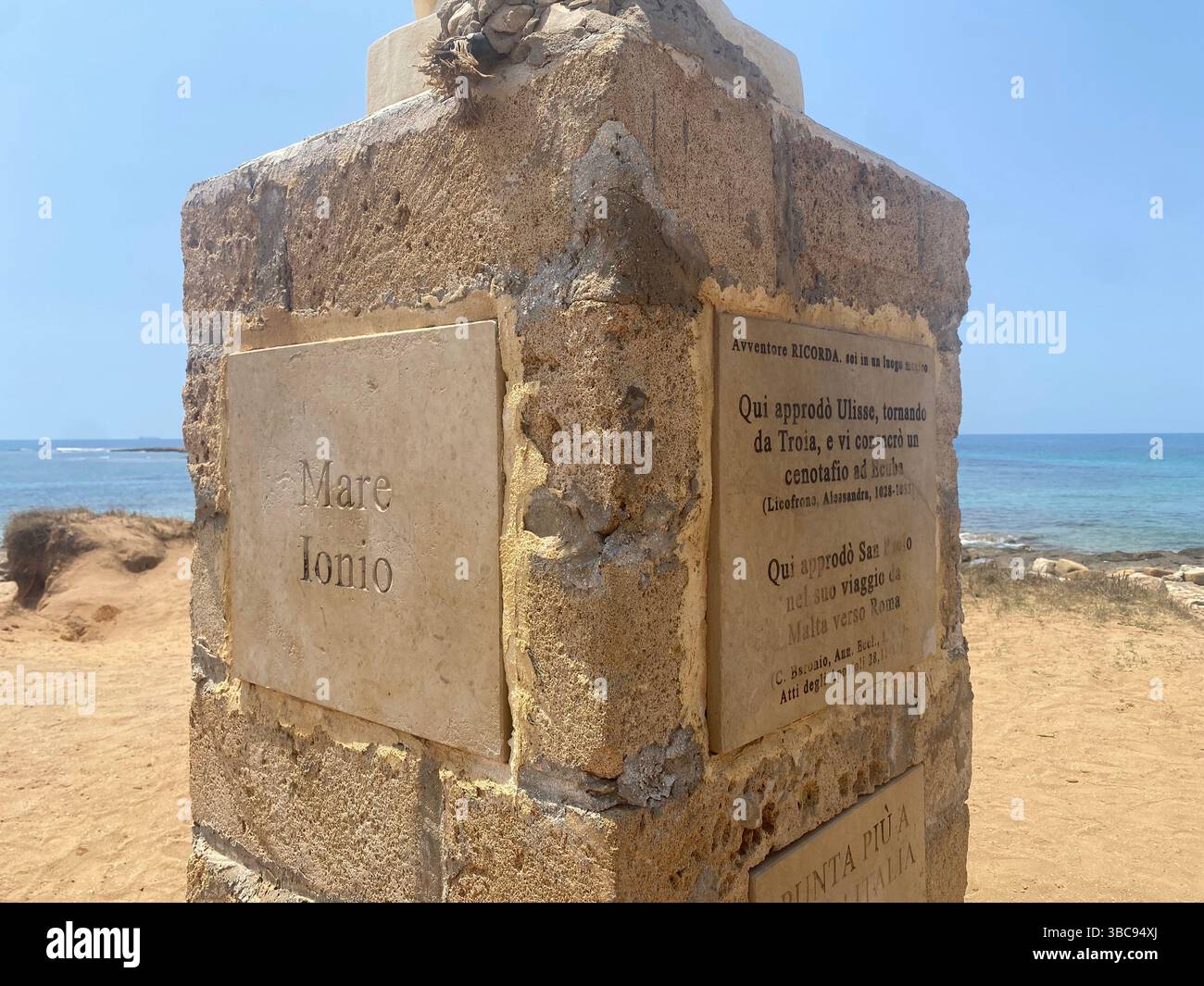 Ancient stone landmark perched above Ionian Sea coastline, marking ...