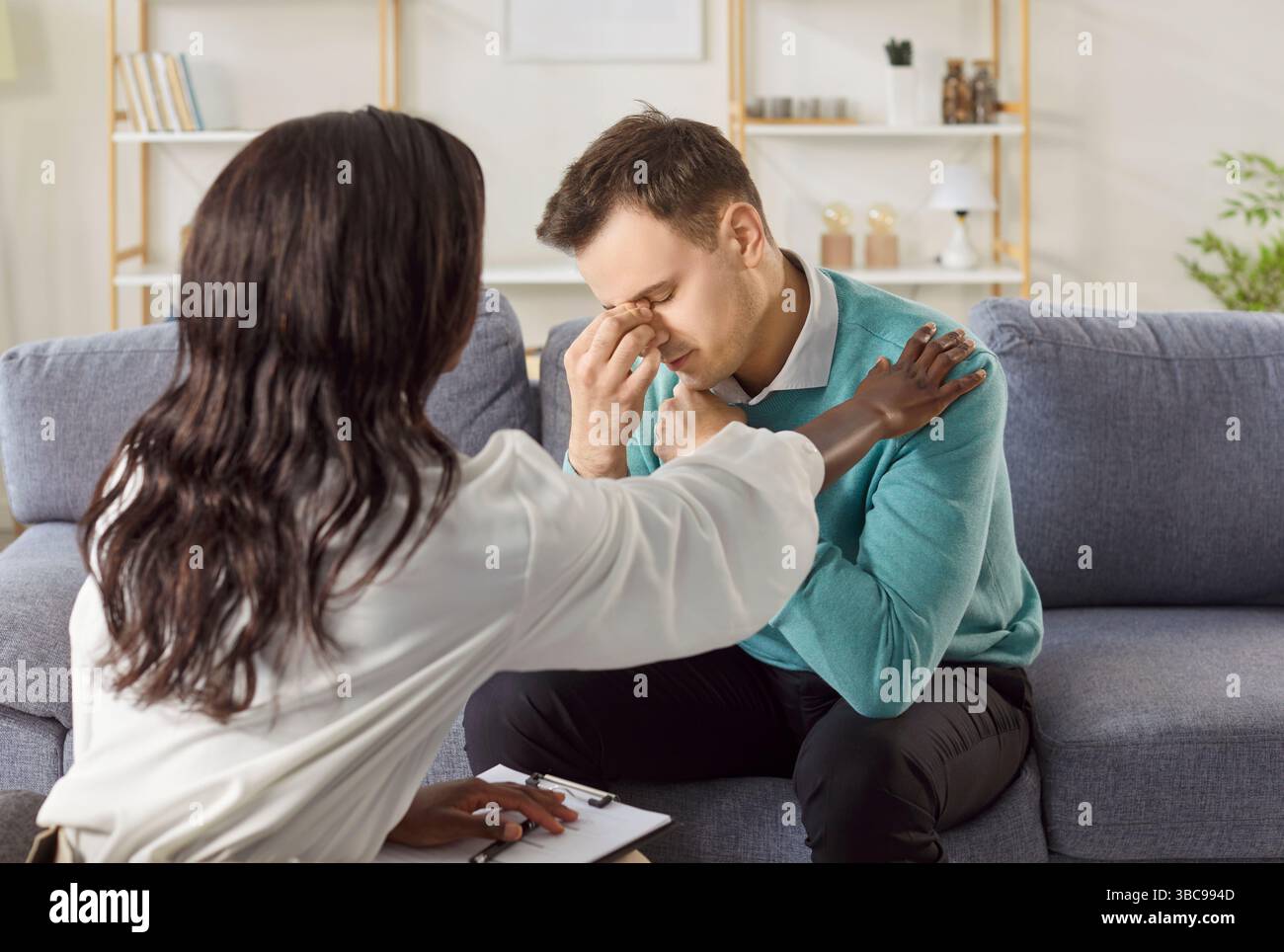 African american psychiatrists, psychologists supporting man, showing ...