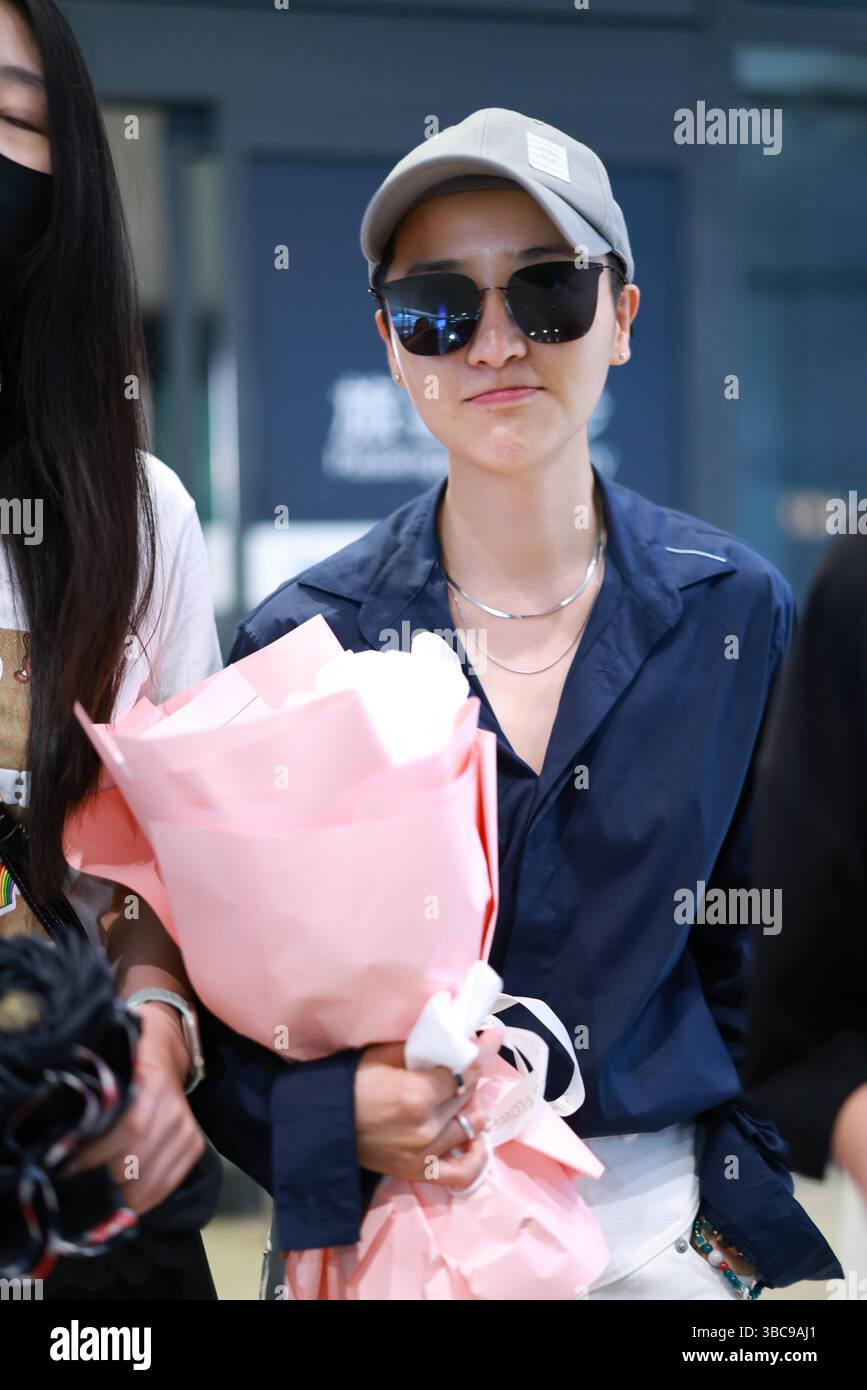 Chinese singer Jiang Yiqiao appears at the airport in Shanghai, China, 16 May, 2025 Stock Photo ...
