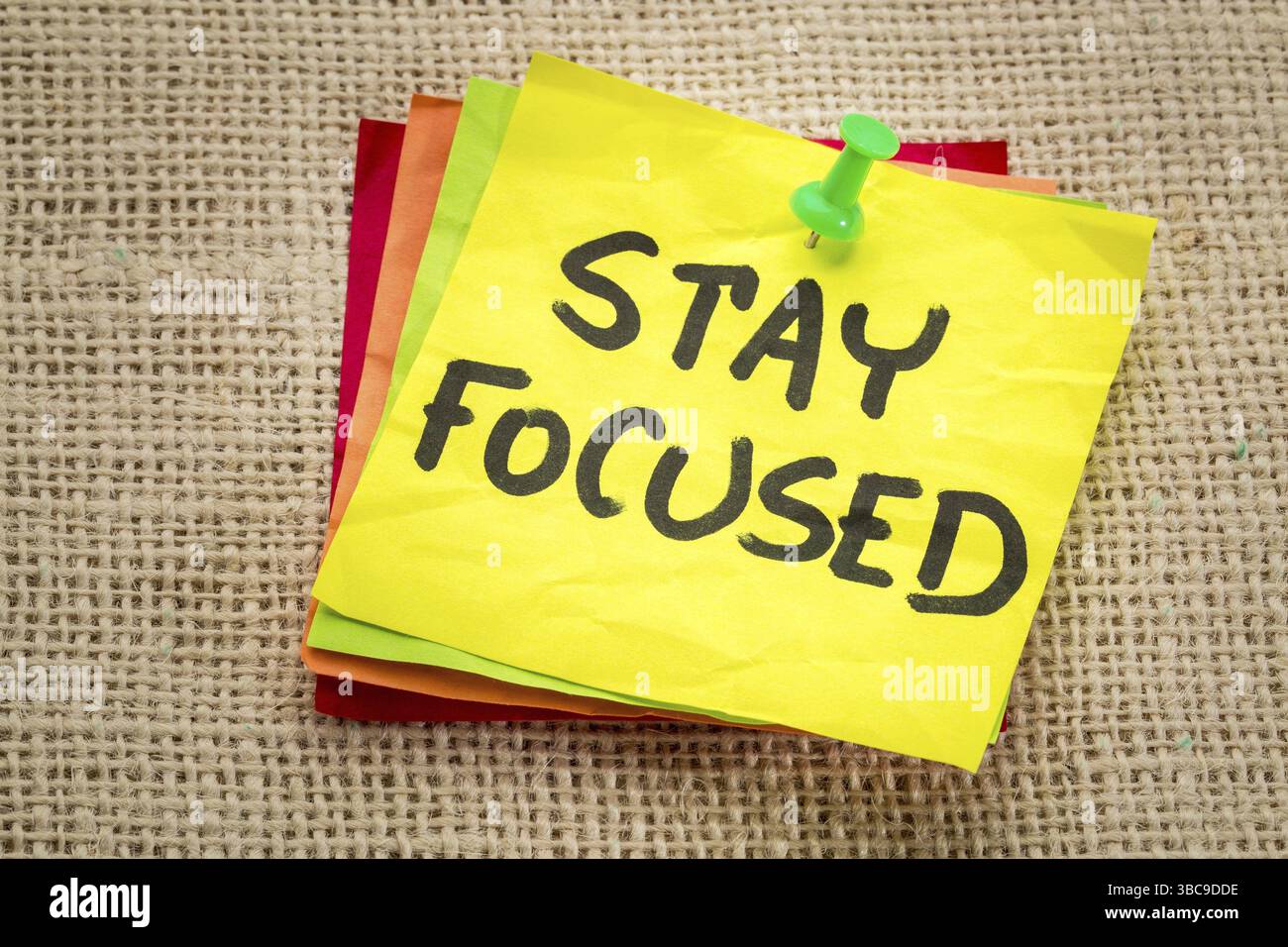 Stay focused reminder on a sticky note - motivation concept Stock Photo ...