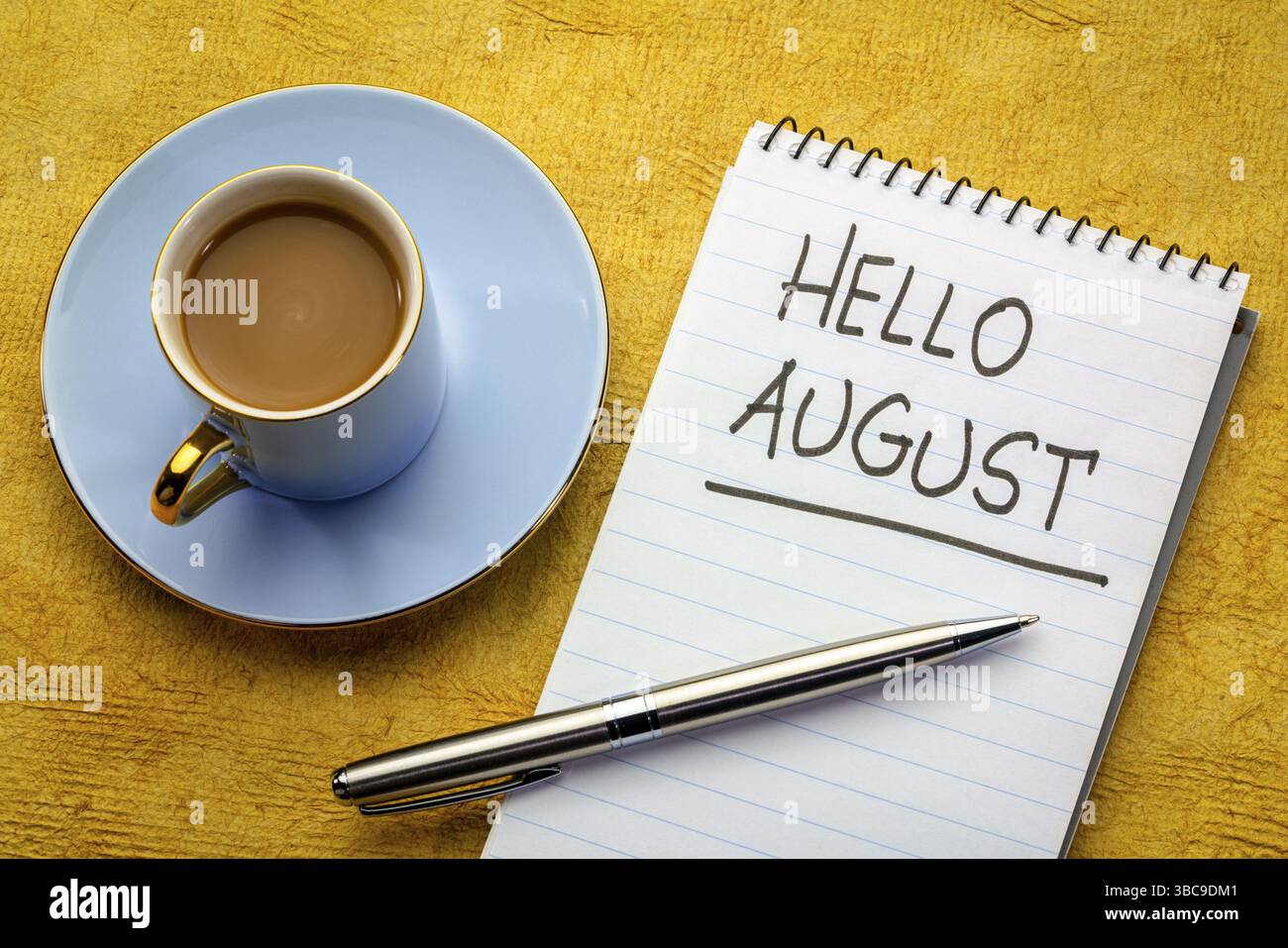 Hello August - handwriting in a notebook with a cup of coffee Stock ...
