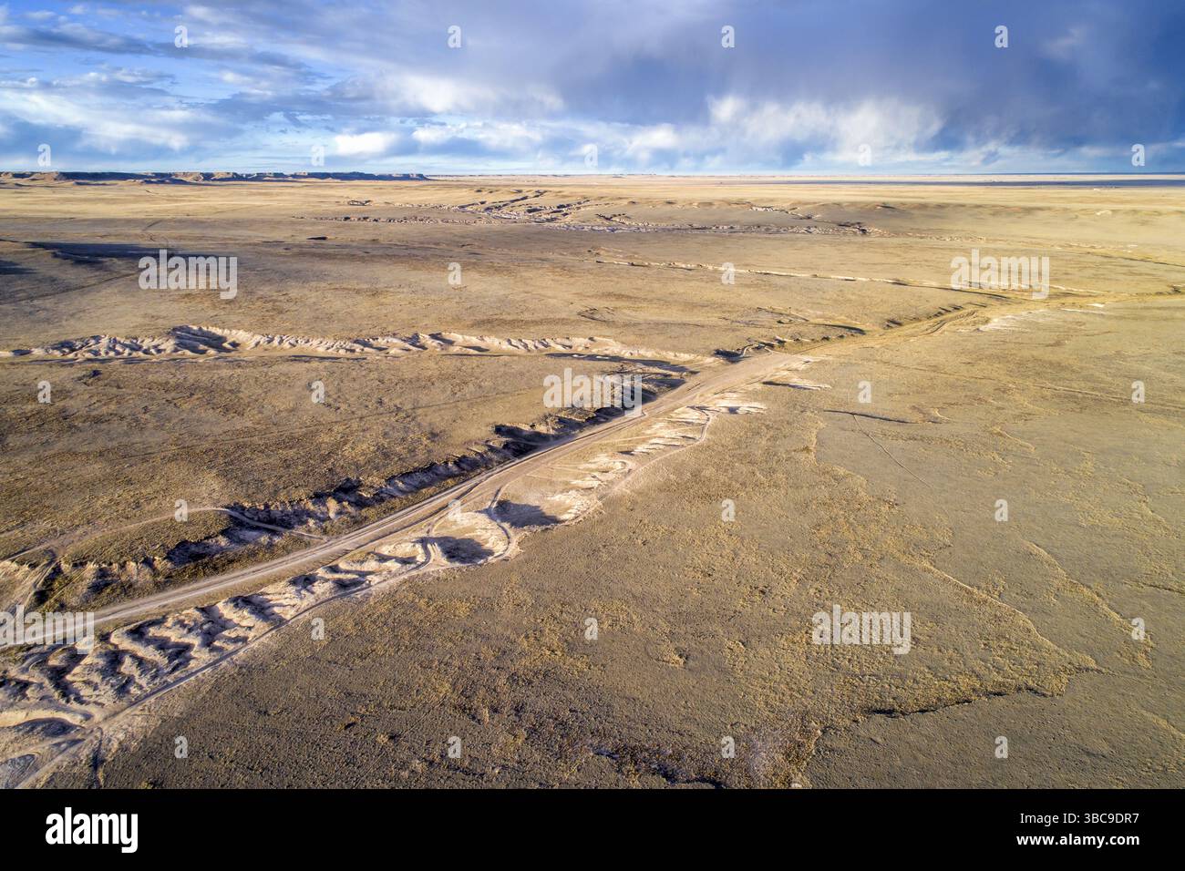 Trail winding through prairie in northern Colorado, early spring aerial ...