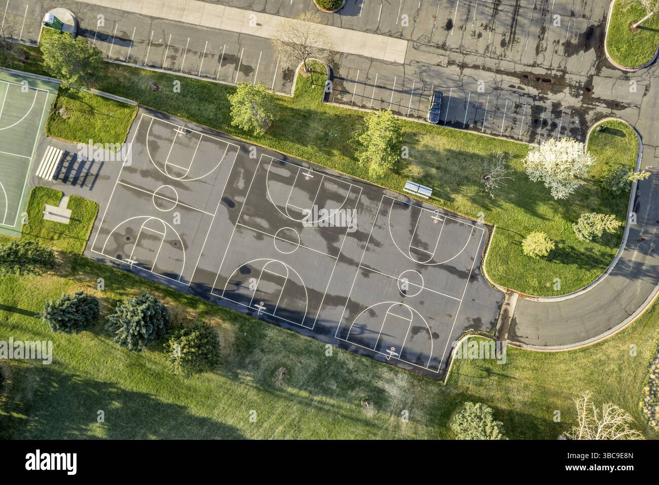 Aerial view of a public park with recreational basketball courts and ...