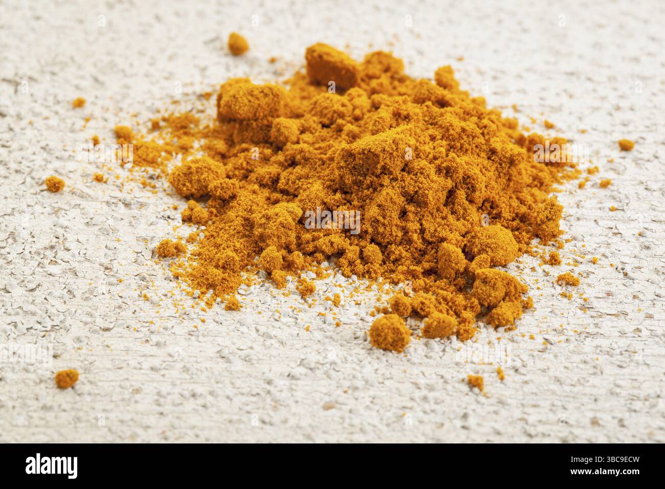 Turmeric powder on a white painted rough barn wood surface Stock Photo ...