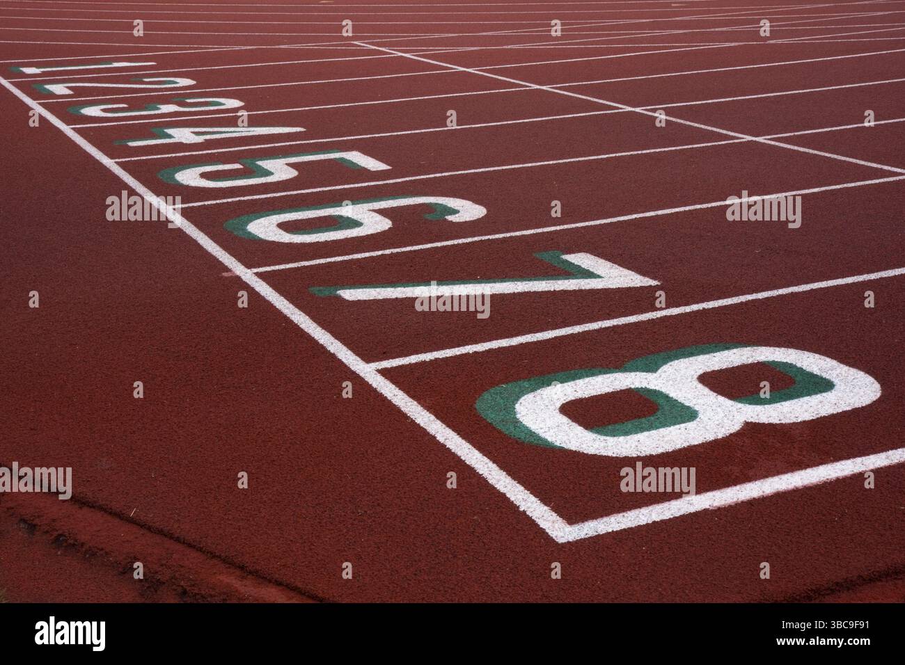 Red running tracks with starting numbers from one to eight Stock Photo ...