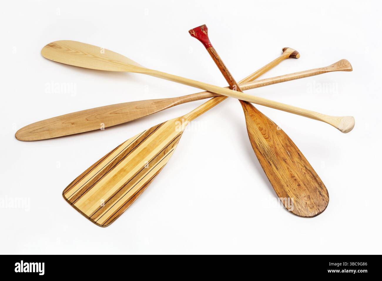 Wooden canoe paddles of different shapes and sizes including a classic ...