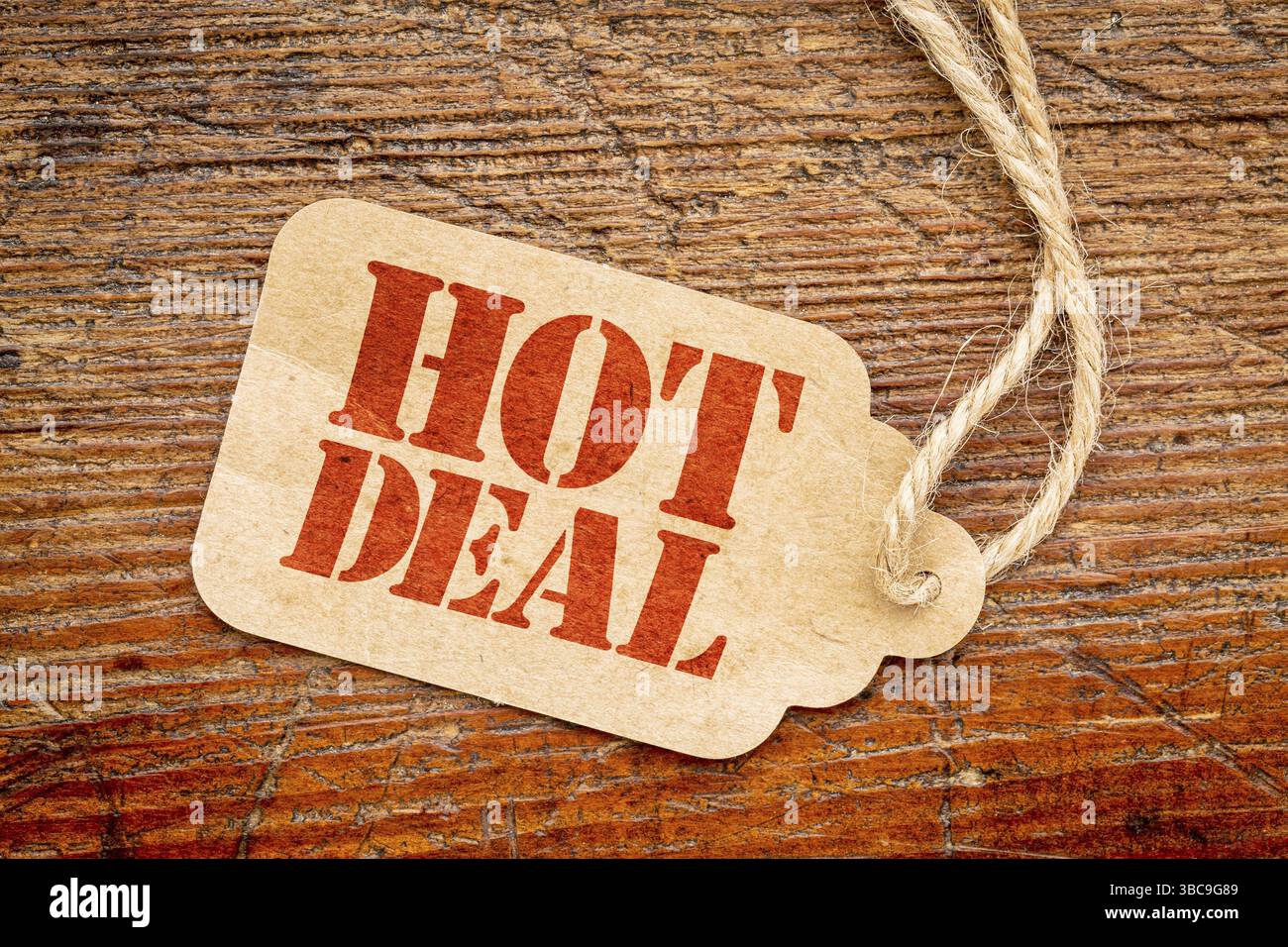 Hot deal sign a paper price tag against rustic red painted barn wood ...