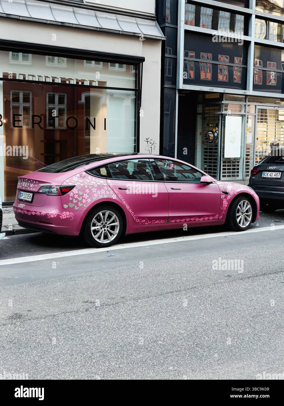 Copenhagen, Denmark - January 12, 2025: Pink Tesla Model 3 vehicle ...