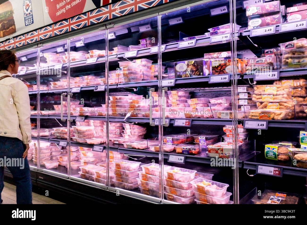 A shopper person woman female shopping inside a Lidl shop store in ...