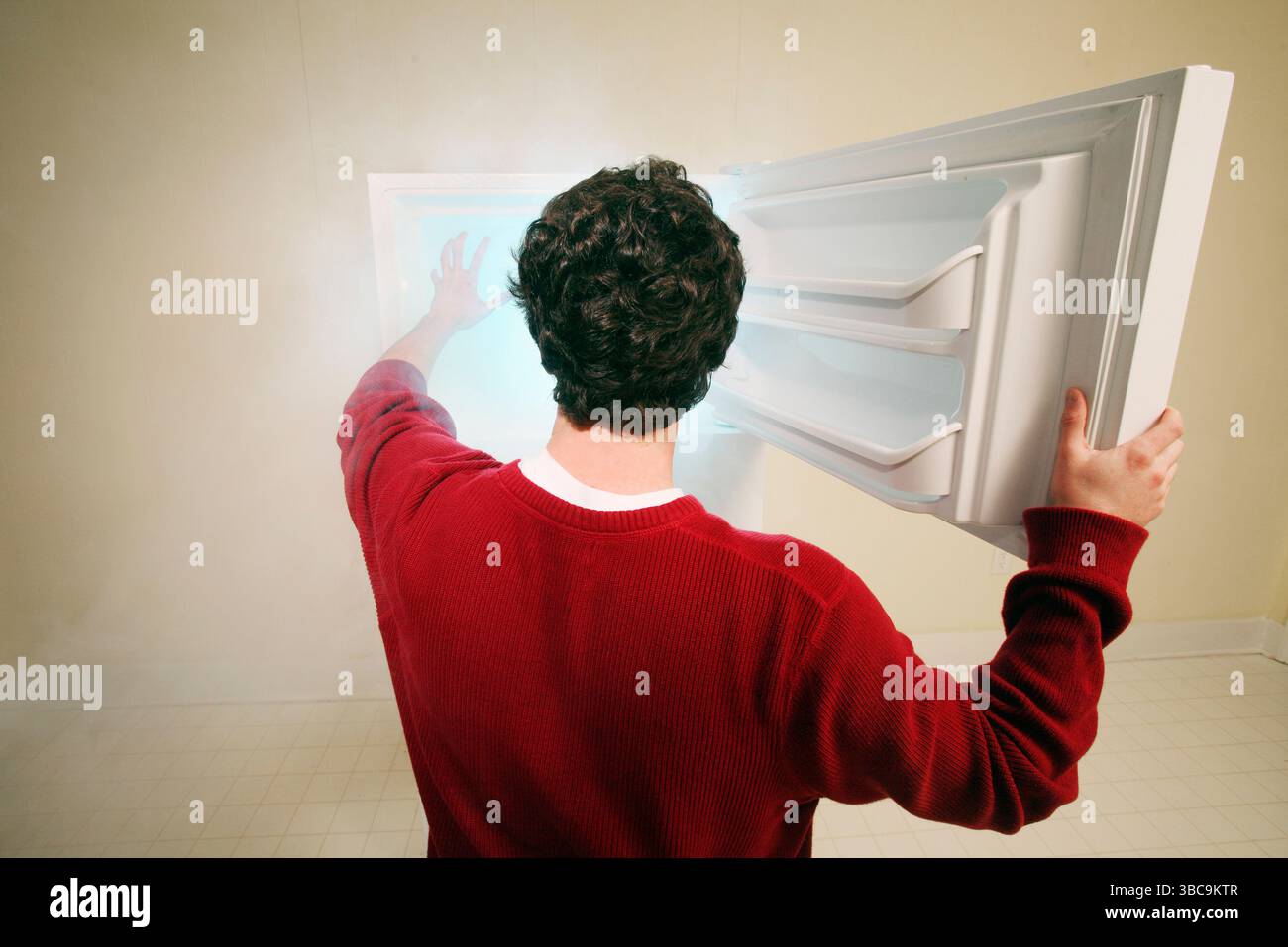 Reaching in freezer hi-res stock photography and images - Alamy