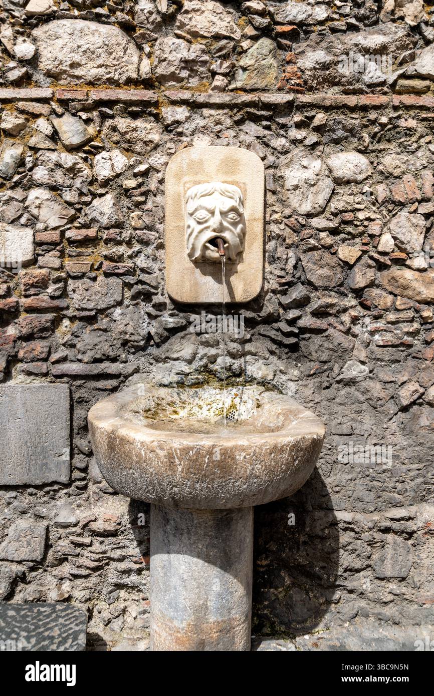 Stone Wall Fountain with Face Spout Sicily Stock Photo - Alamy