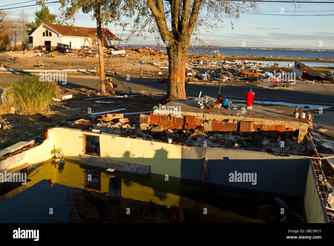 Wreckage from Superstorm Sandy - including cars, roofs, house-walls and ...