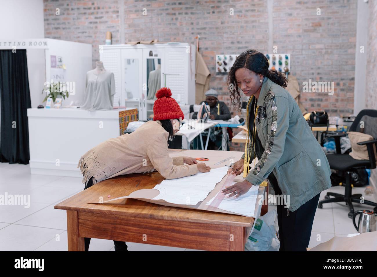 Women in the workplace sewing garments Stock Photo - Alamy