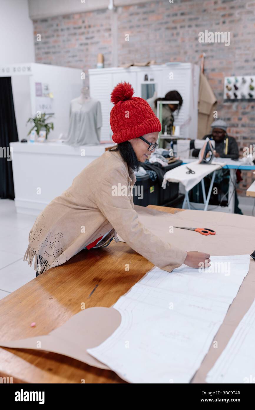 Seamstress creating a pattern to sew Stock Photo - Alamy