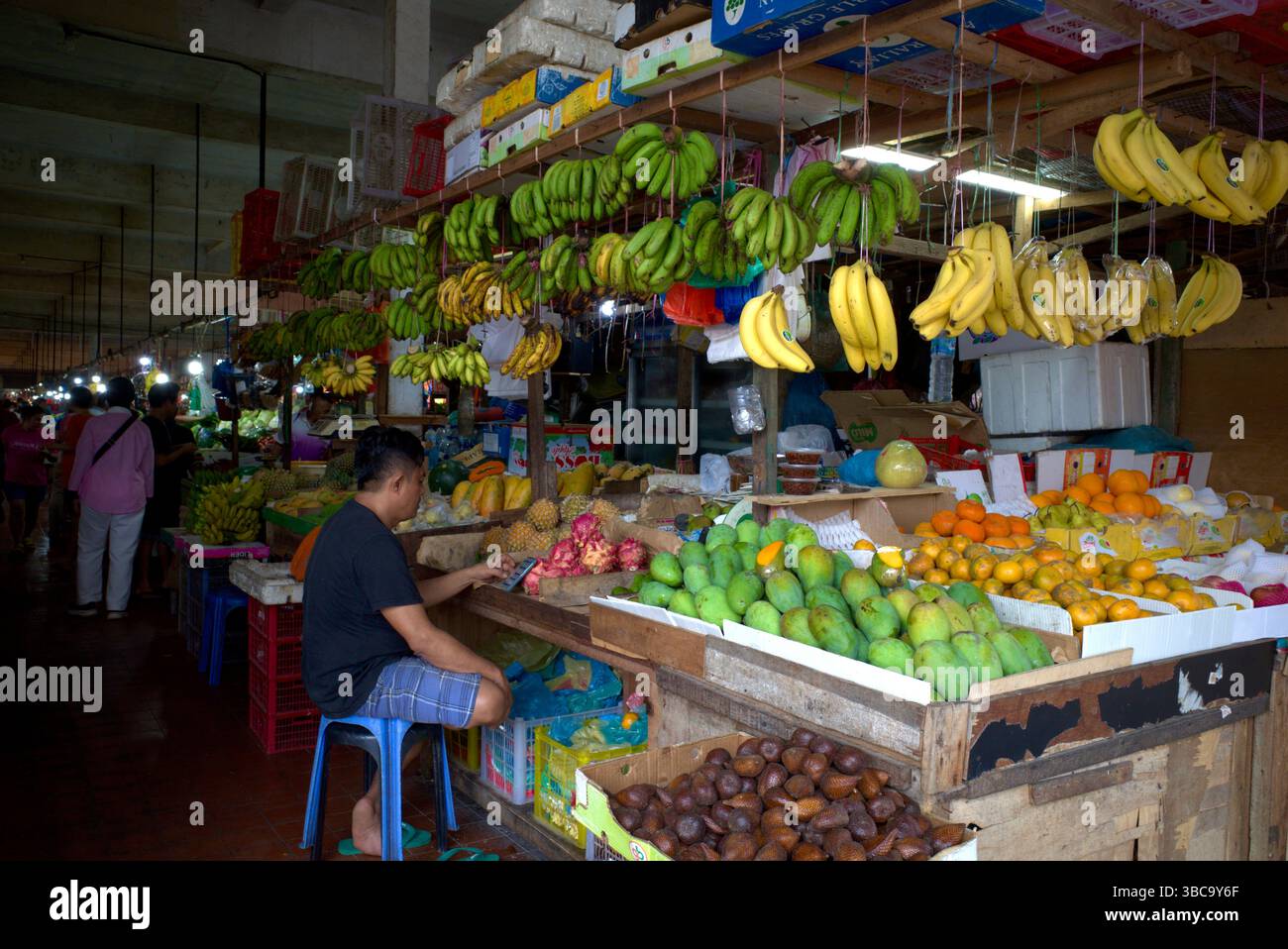 Batam-Indonesia, 30 November 2024: An Indonesian man, a fruit seller at ...