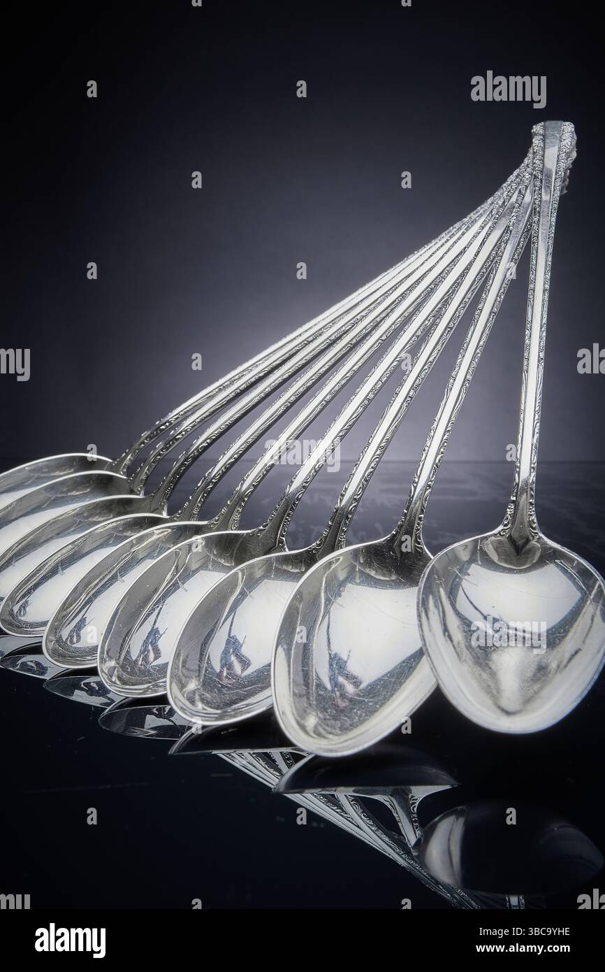 Collection of fanned out silver spoons Stock Photo - Alamy