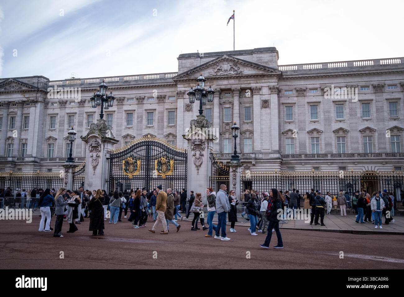 Tourists in front of Buckingham Palace the official residence of the ...