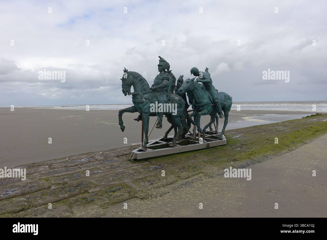 A metal statue depicts horsemen on the beach at Ostend in Belgium Stock ...