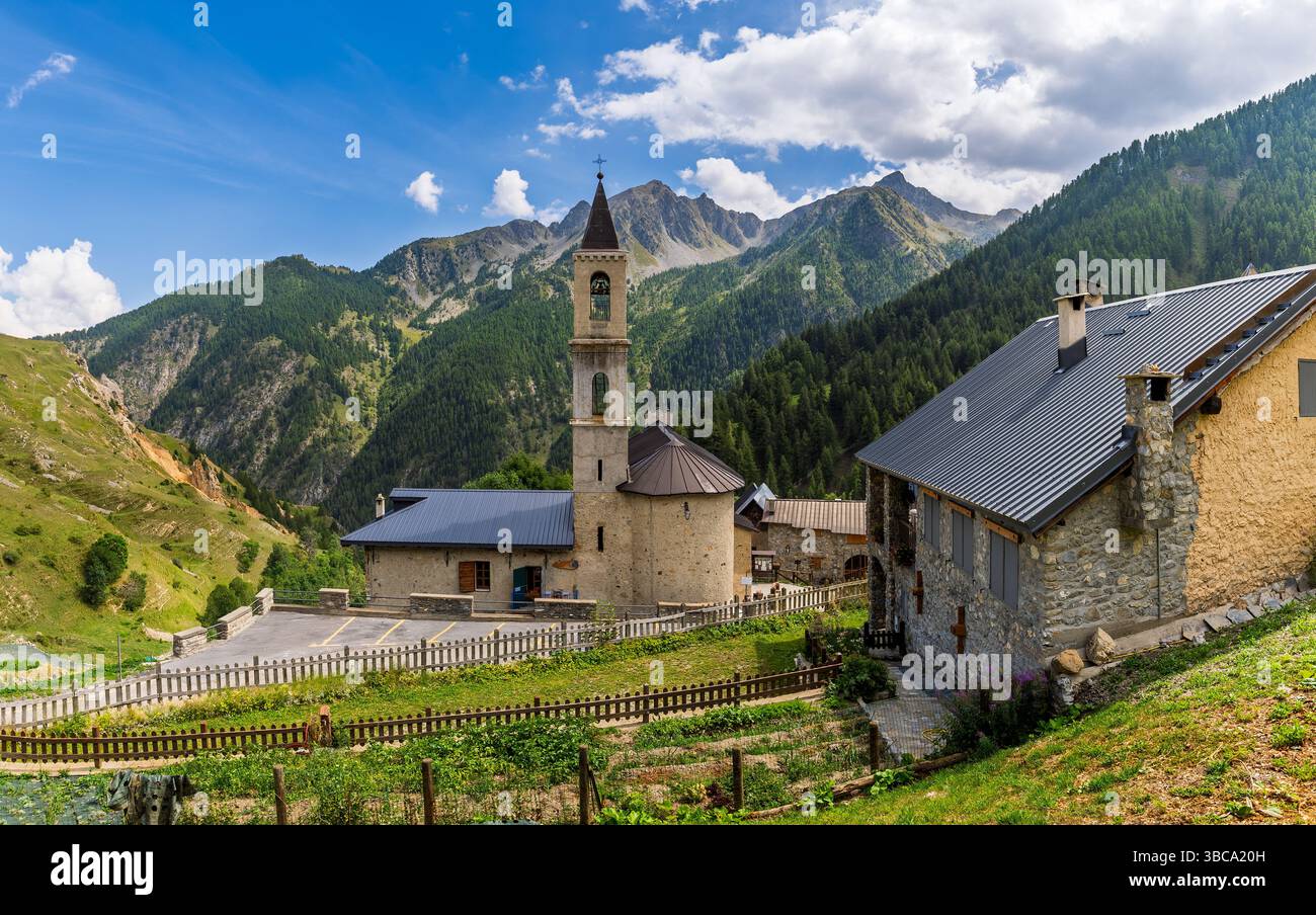 A scenic panoramic view of a stone church in the mountain village of ...