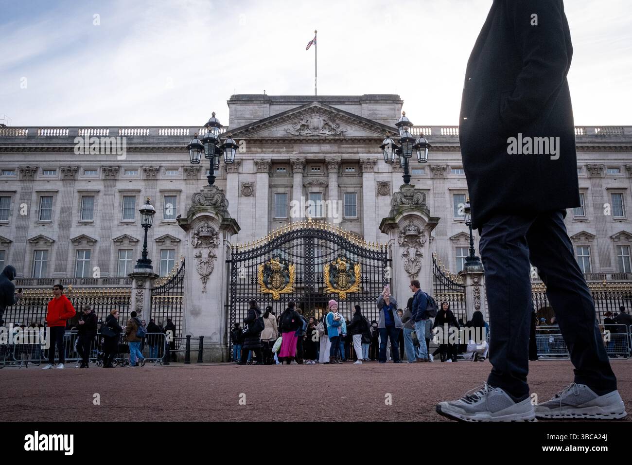 Tourists in front of Buckingham Palace the official residence of the ...