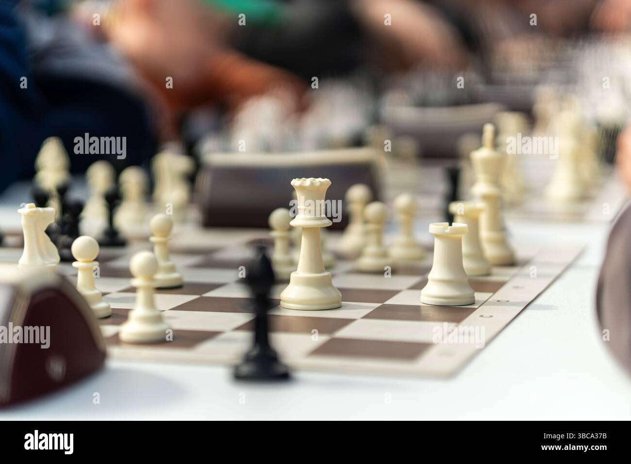 Outdoor chess board with plastic pieces. public area zone. Close up big ...